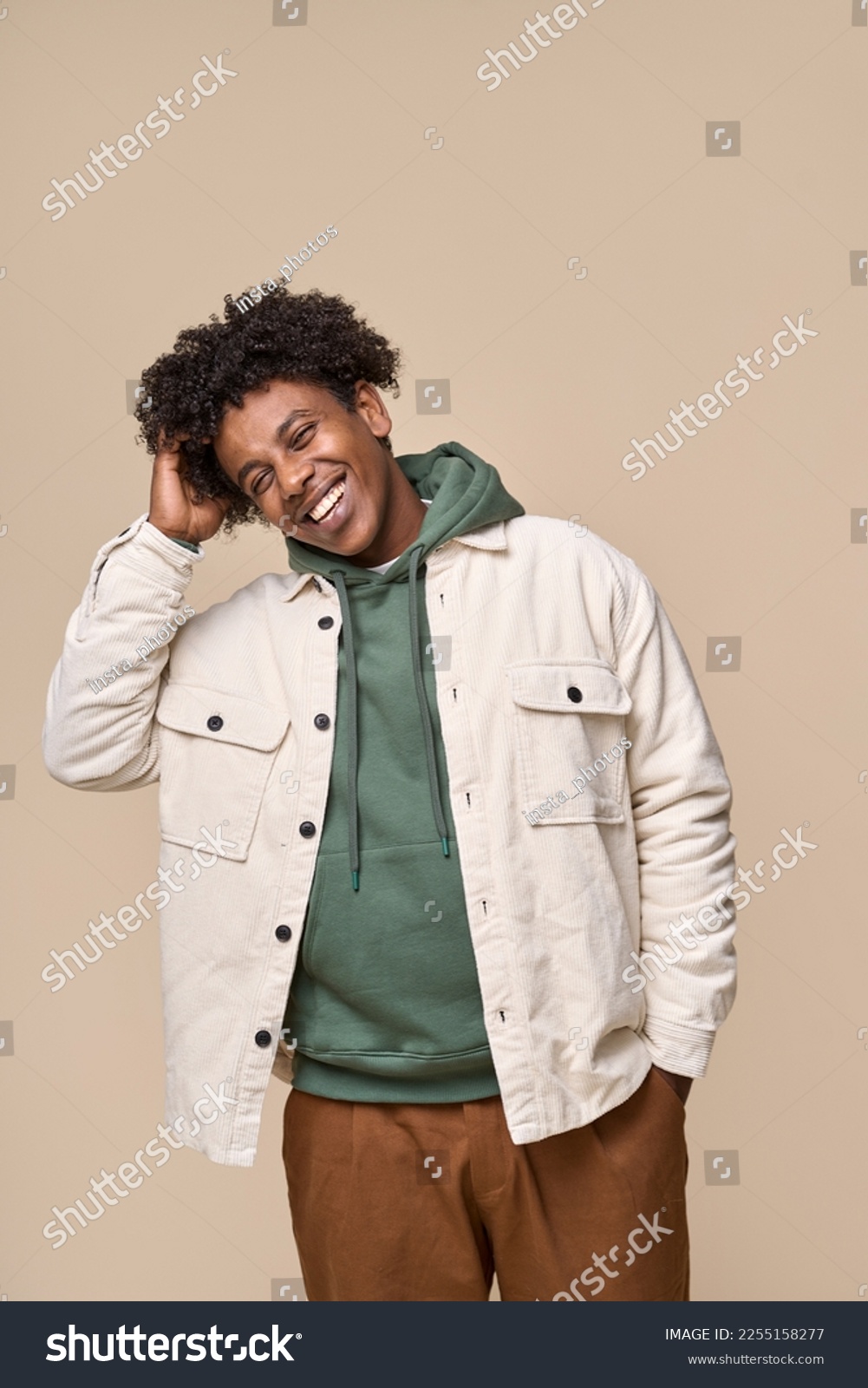 Happy young African American gen z guy isolated on beige background. Smiling hipster ethnic teen ...