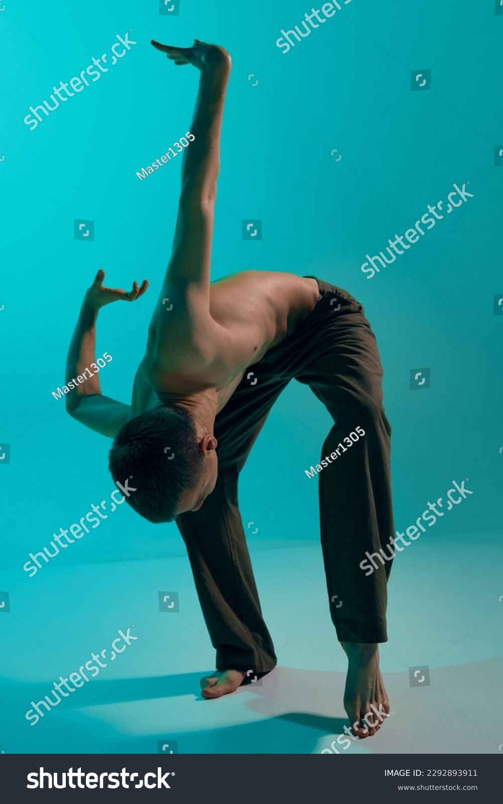 Contemporary dance style. Young shirtless flexible artistic man dancing ...