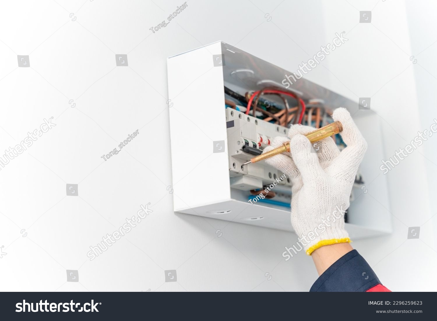 Bay control unit. Hand of Electrician engineer work tester measuring ...