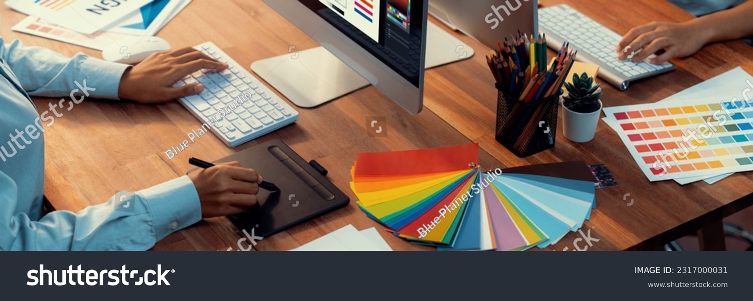 Graphic designer work on computer laptop and with graphic drawing pen ...