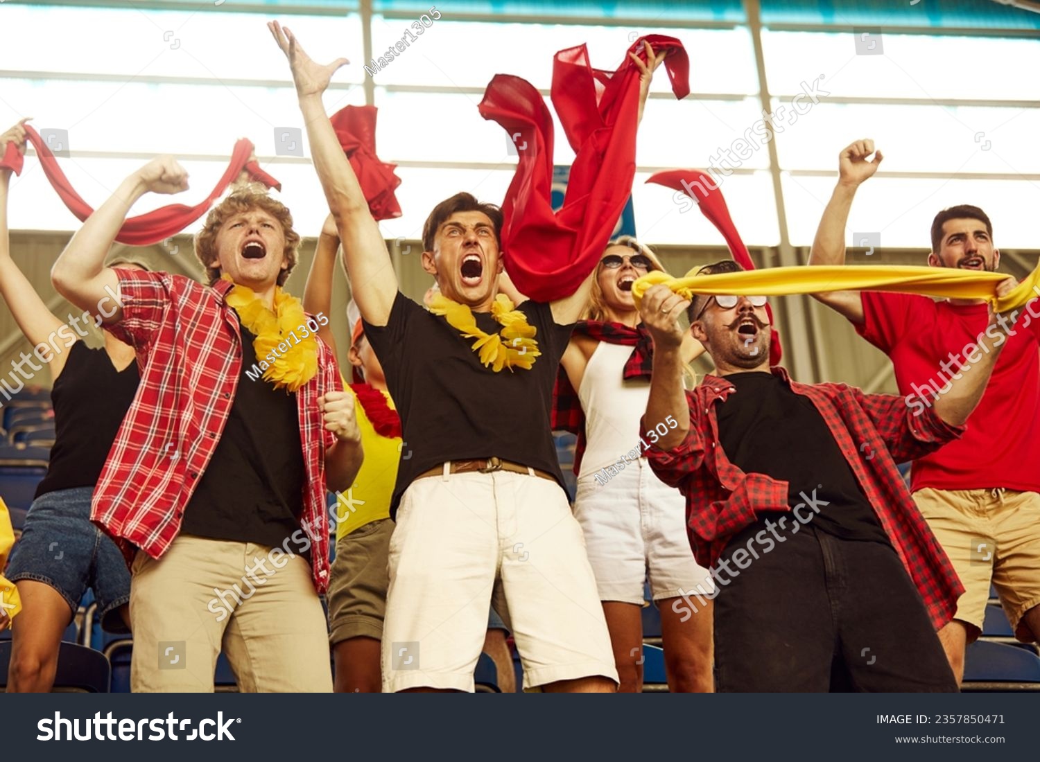 Group of young people sports fans enthusiasts shouting cheering up ...