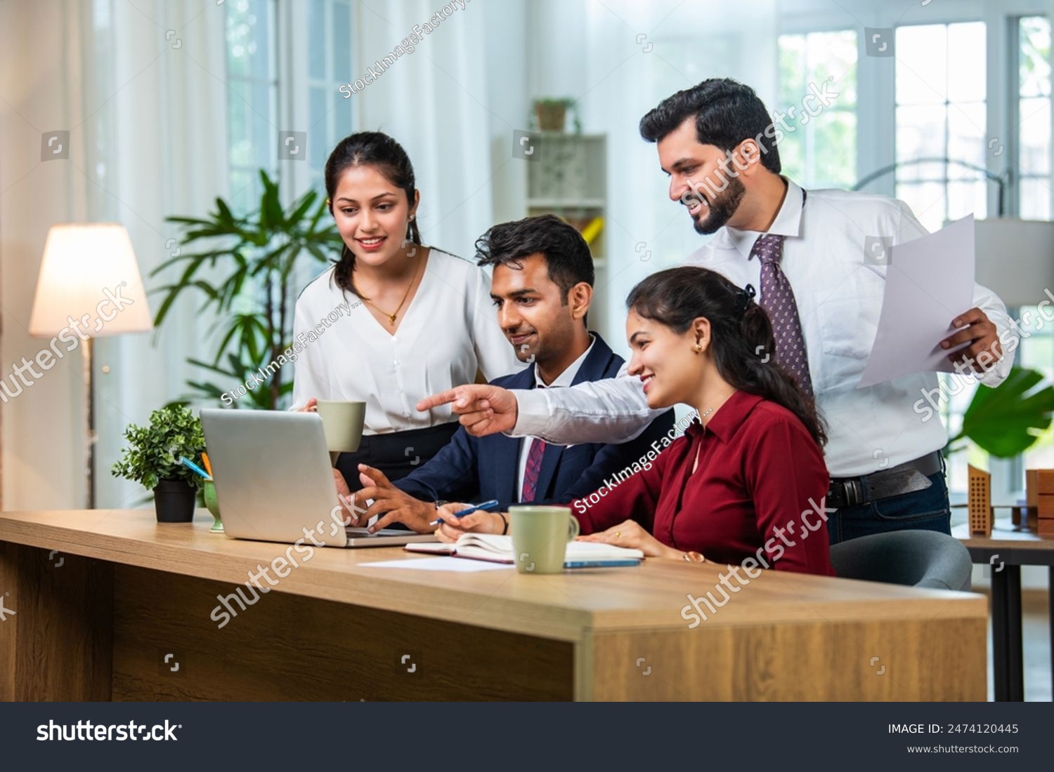 Indian asian young business professionals using laptop on desk discussing strategy_站酷海洛_正版图片_视频 ...