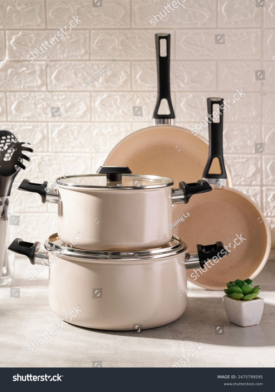 Inox or stainless steel cooking utensil set including slotted pans pots ...