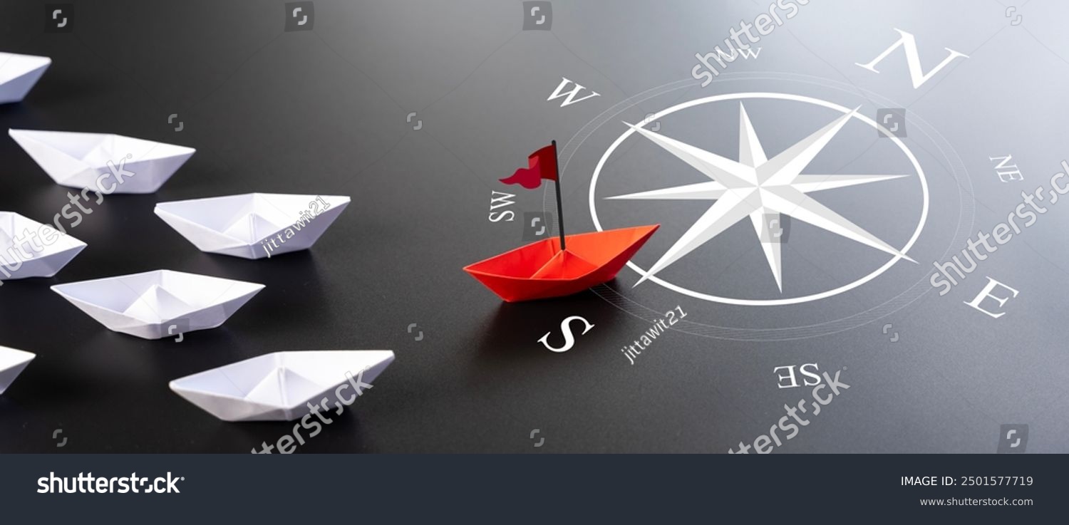 Red Paper Boat On Compass Leading A Fleet Of Small White Boats ...