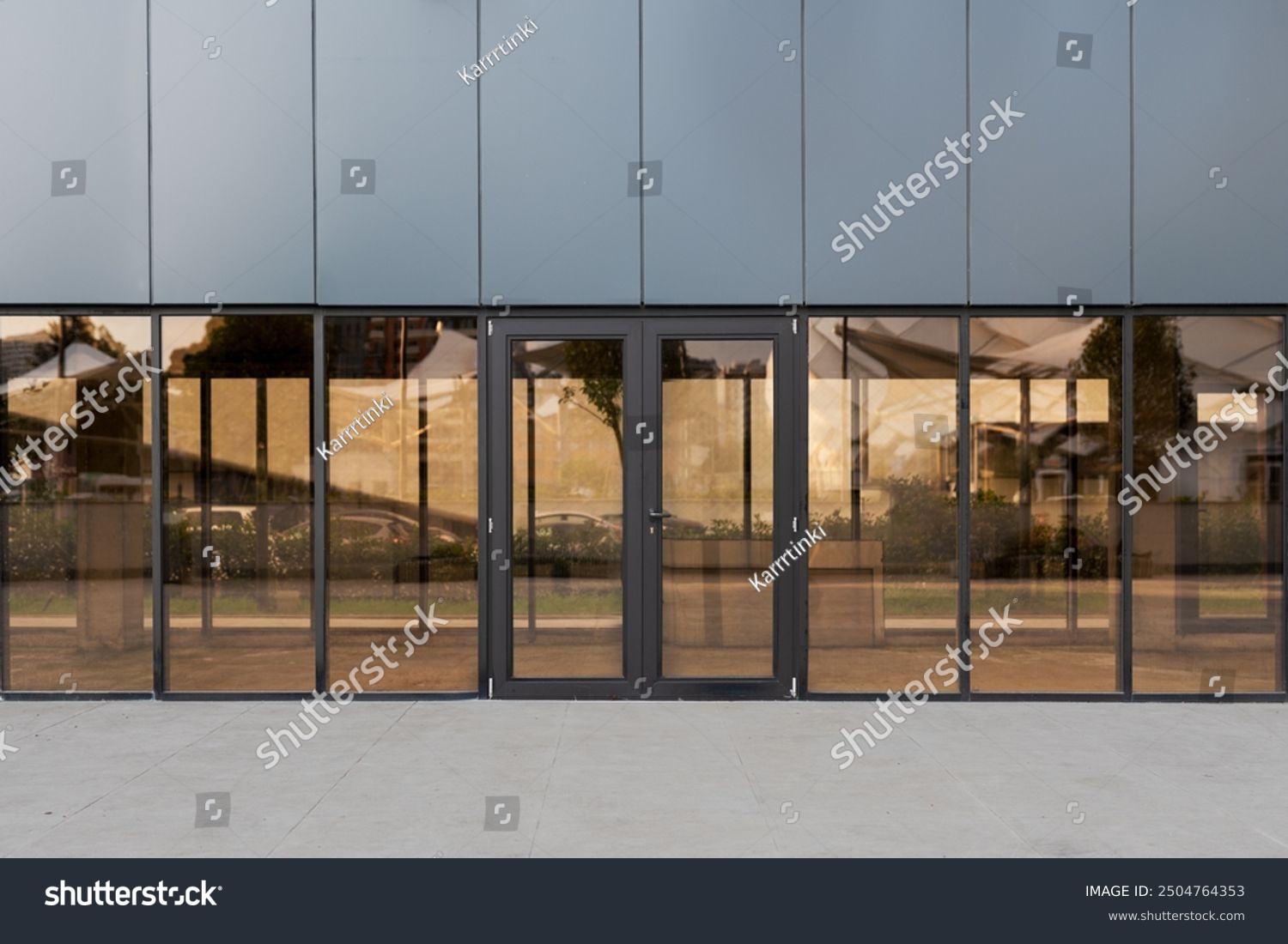 Modern storefront with large glass windows and central entrance ideal ...