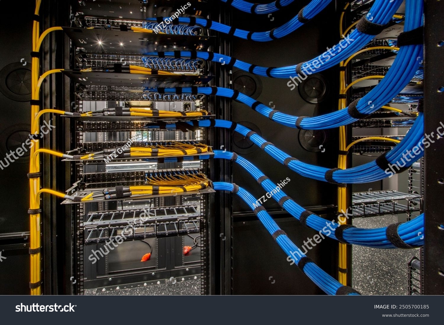 A close-up photo of a server rack with numerous blue and yellow cables ...