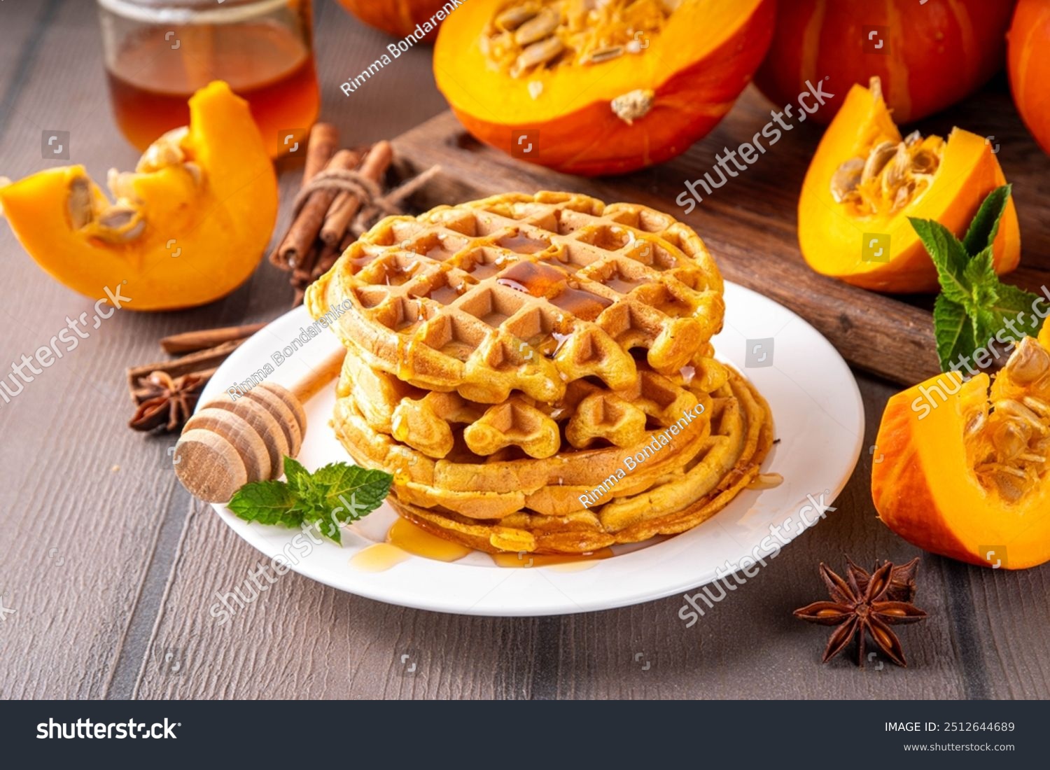 Autumn breakfast dessert pumpkin waffle. Stack of homemade belgian ...