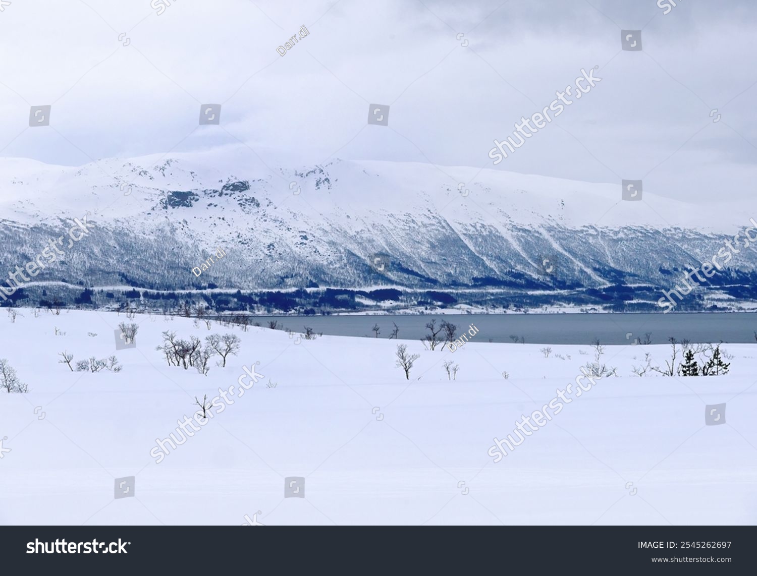 Breathtaking dramatic scene of white snow mountain against the sky ...