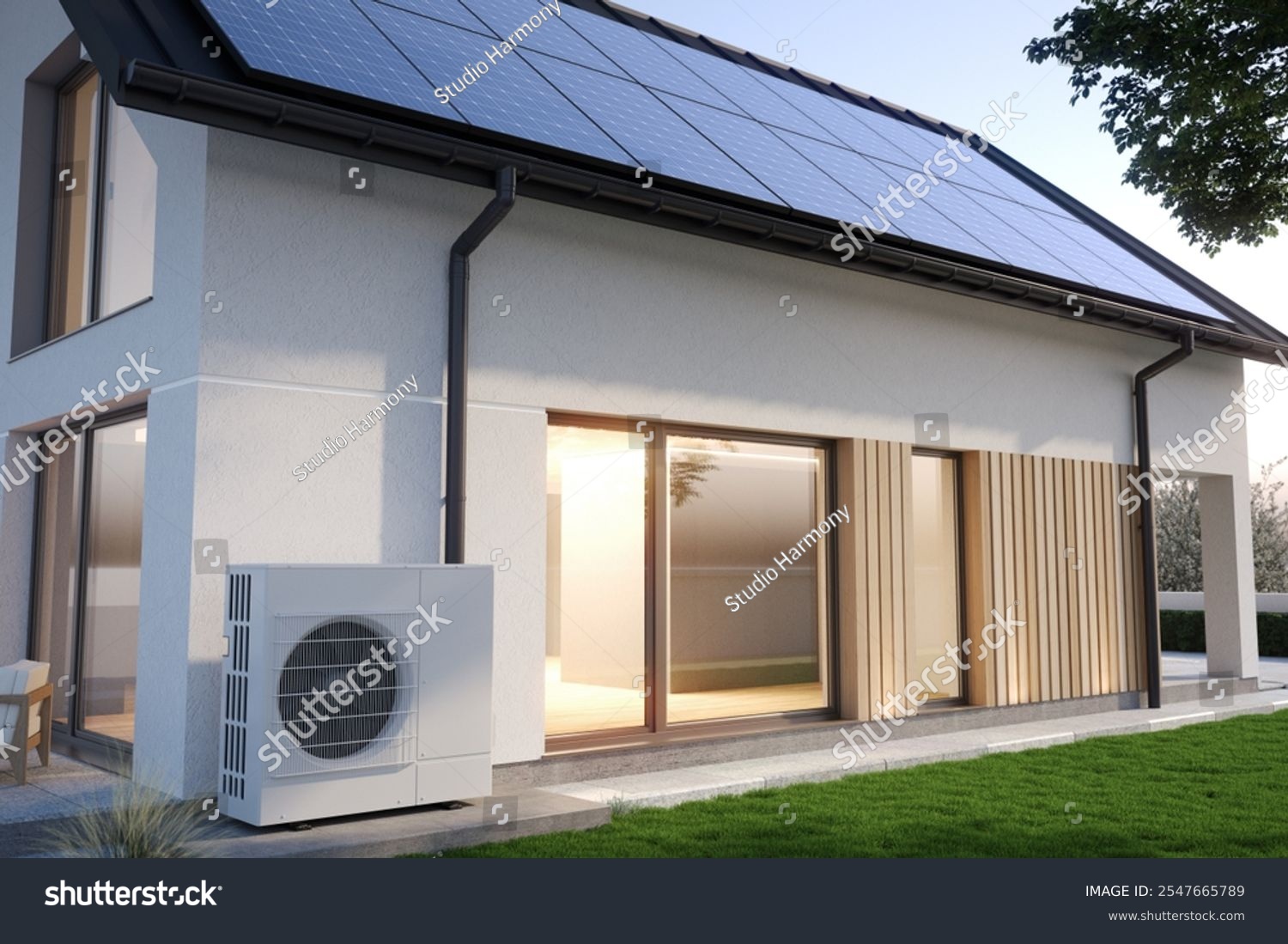 Heat pump next to the house and solar panels on the roof. The concept of an energy-efficient ...