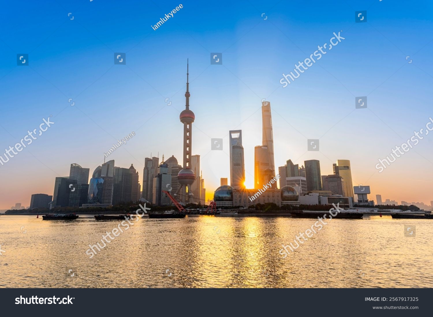 Morning sun rise of Shanghai city modern skyscraper cityscape in blue ...