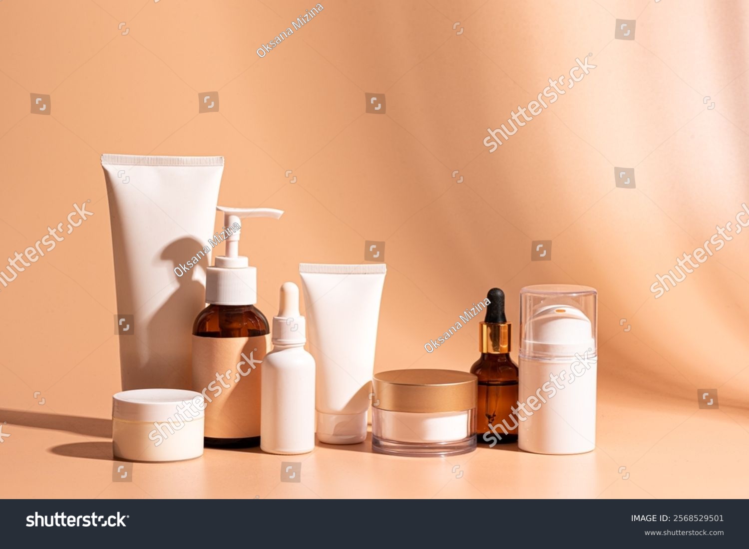 Various cosmetic products containers and bottles on beige orange ...