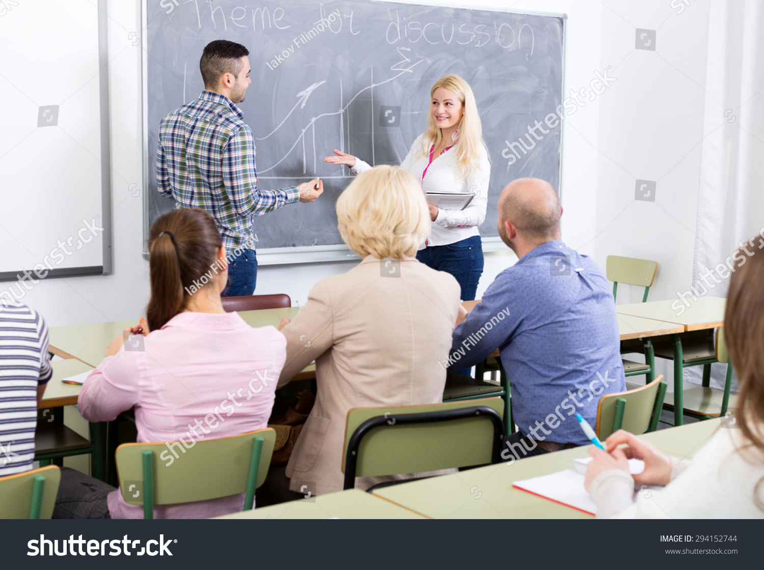 Professionals and female coach at training session for employees_站酷海洛 ...