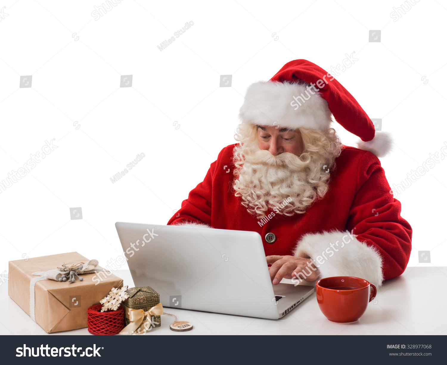 Santa Claus reading children letters and writing responses to them ...