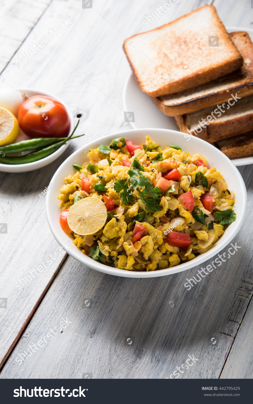Masala Anda Bhurji of egg bhurji or Spicy scrambled eggs with bread or ...