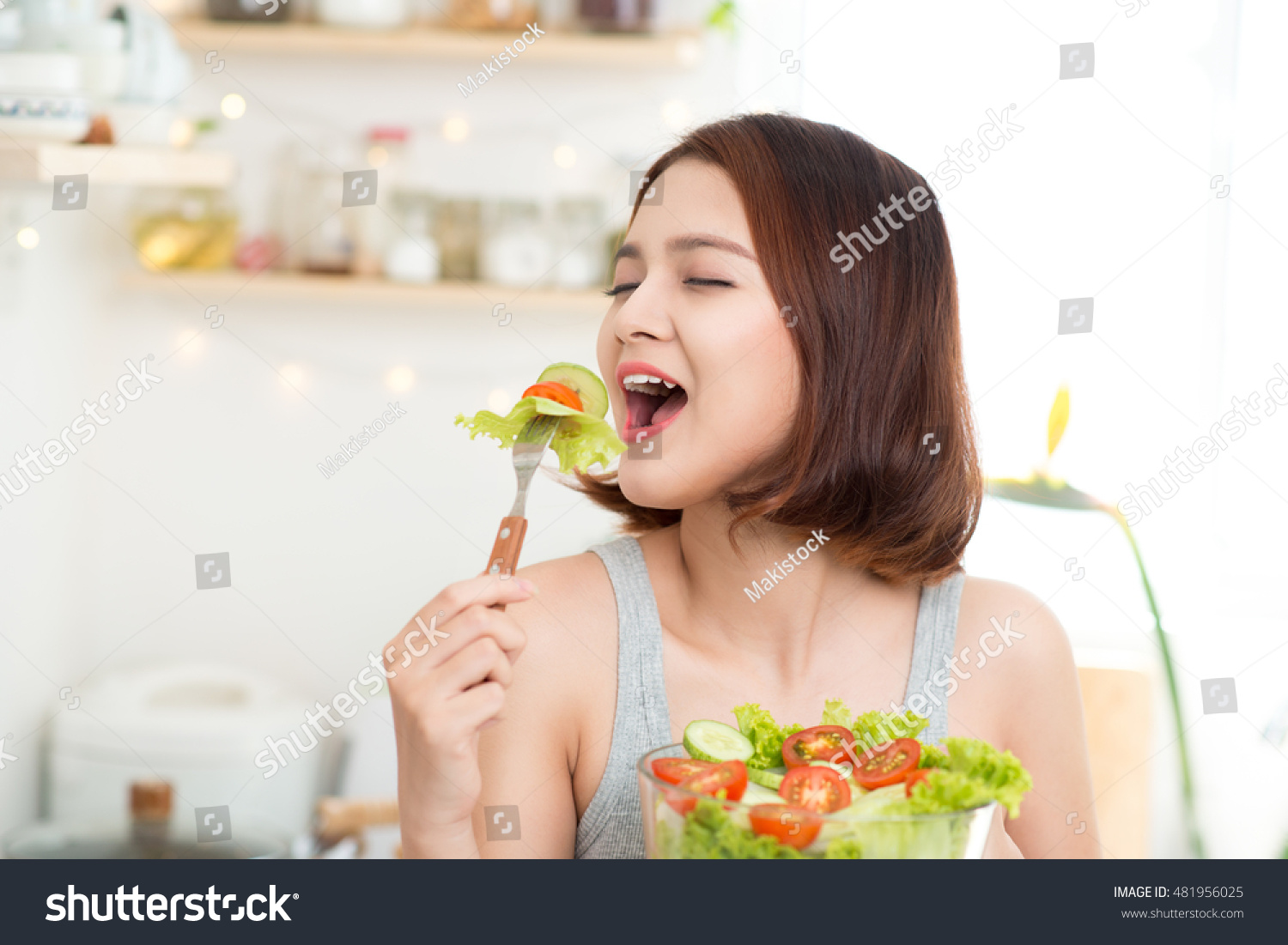 Beautiful young asian girl eating salad. smiling happy girl eating healthy food._站酷海洛_正版图片_视频_字体 ...