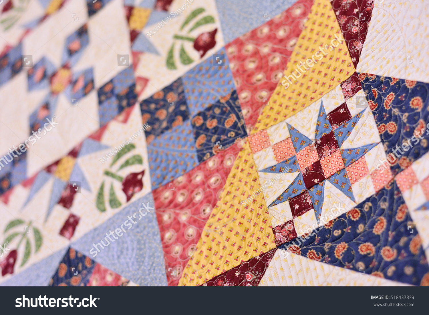 Patchwork quilt. Part of patchwork quilt as background. Flower print ...