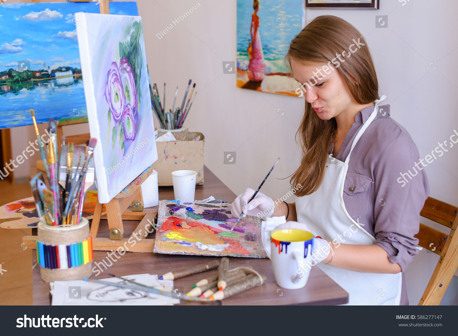 Young Woman Artist Draws Oil Painting With Purple Flowers on a White Canvas_站酷海洛_正版图片_视频_字体_音乐素材 ...