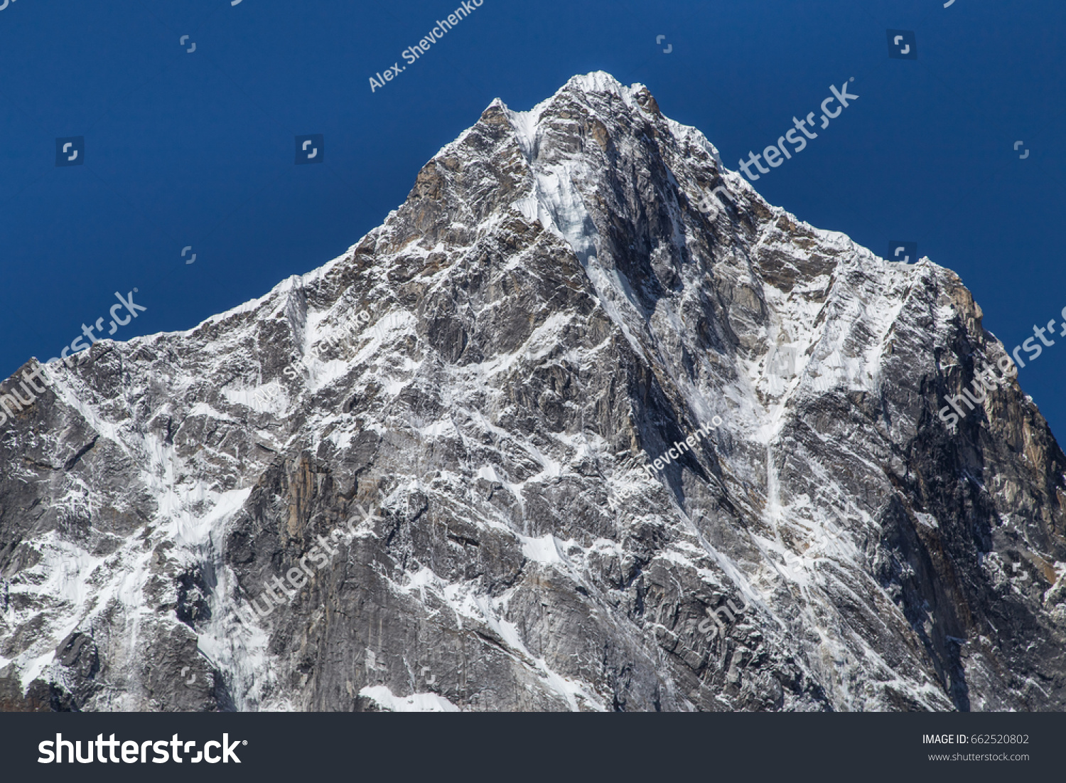 Close view on summit of mount Cholatse with deep blue sky from a trek ...