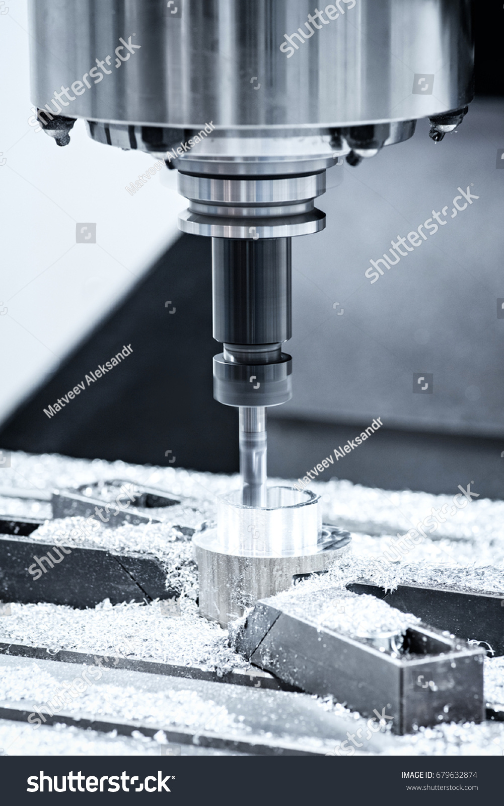 The Hi-precision CNC milling machine with cutting sample in blue-silver ...