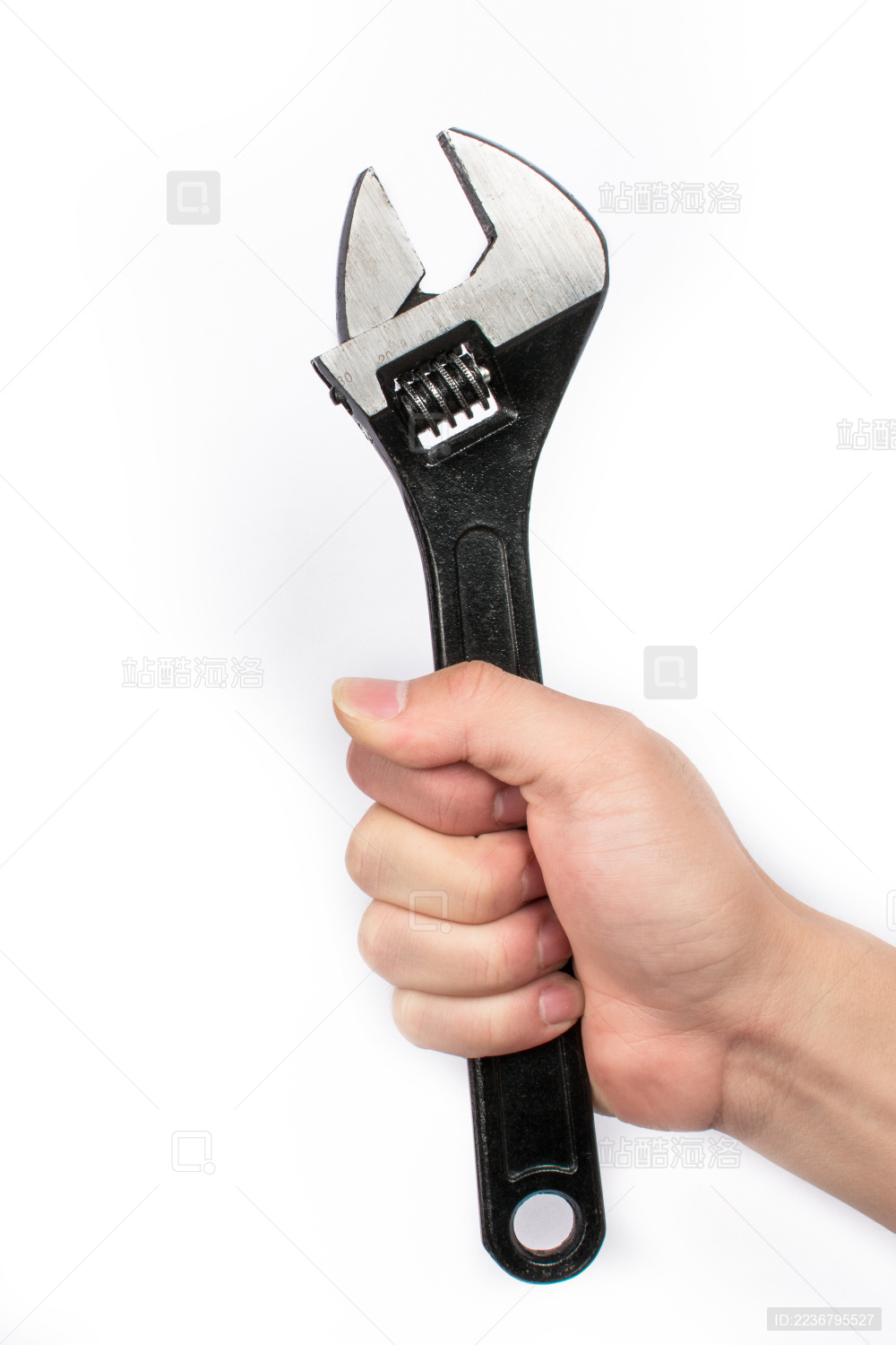 白色背景上一个亚洲人的手握着一把黑色的活动扳手_站酷海洛_正版图片_视频_字体_音乐素材交易平台_站酷旗下品牌